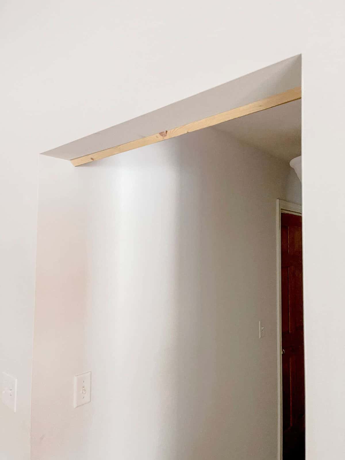 How to Make a Faux Wood Beam Door Header - Grace In My Space